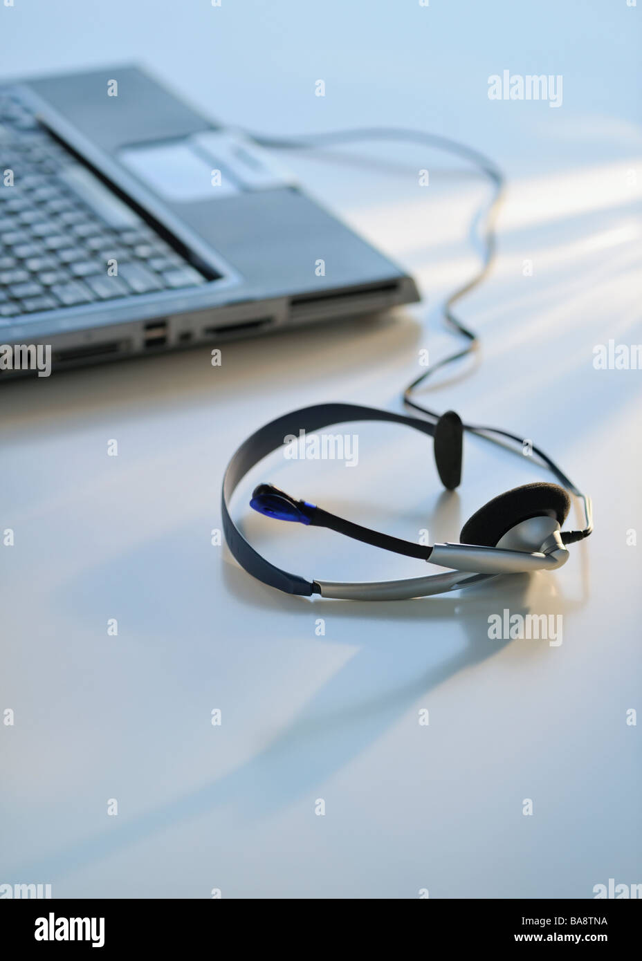 Headset and laptop Stock Photo - Alamy