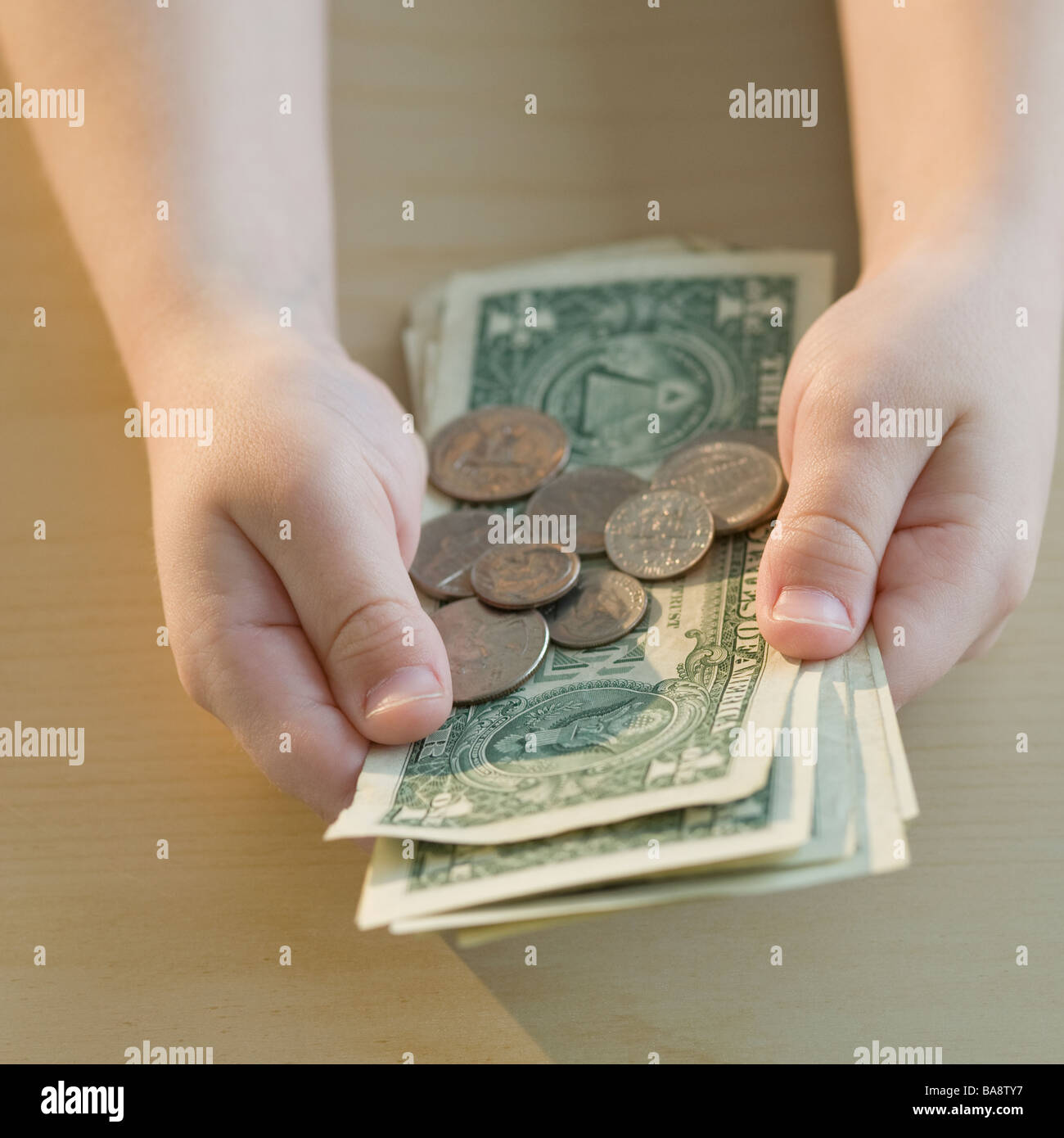 Boy holding money Stock Photo - Alamy