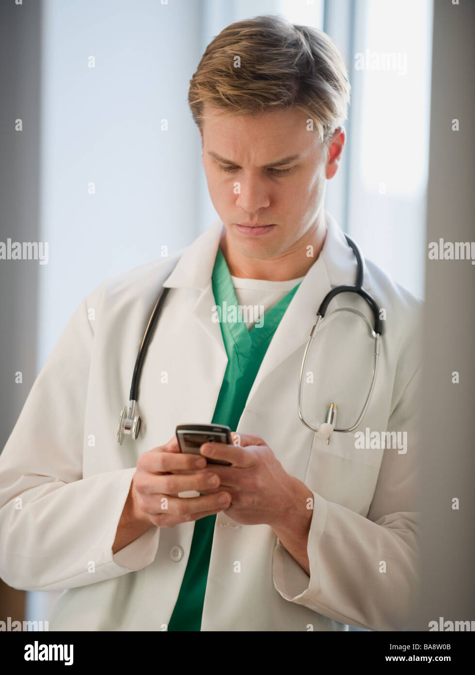 Doctor text messaging Stock Photo - Alamy