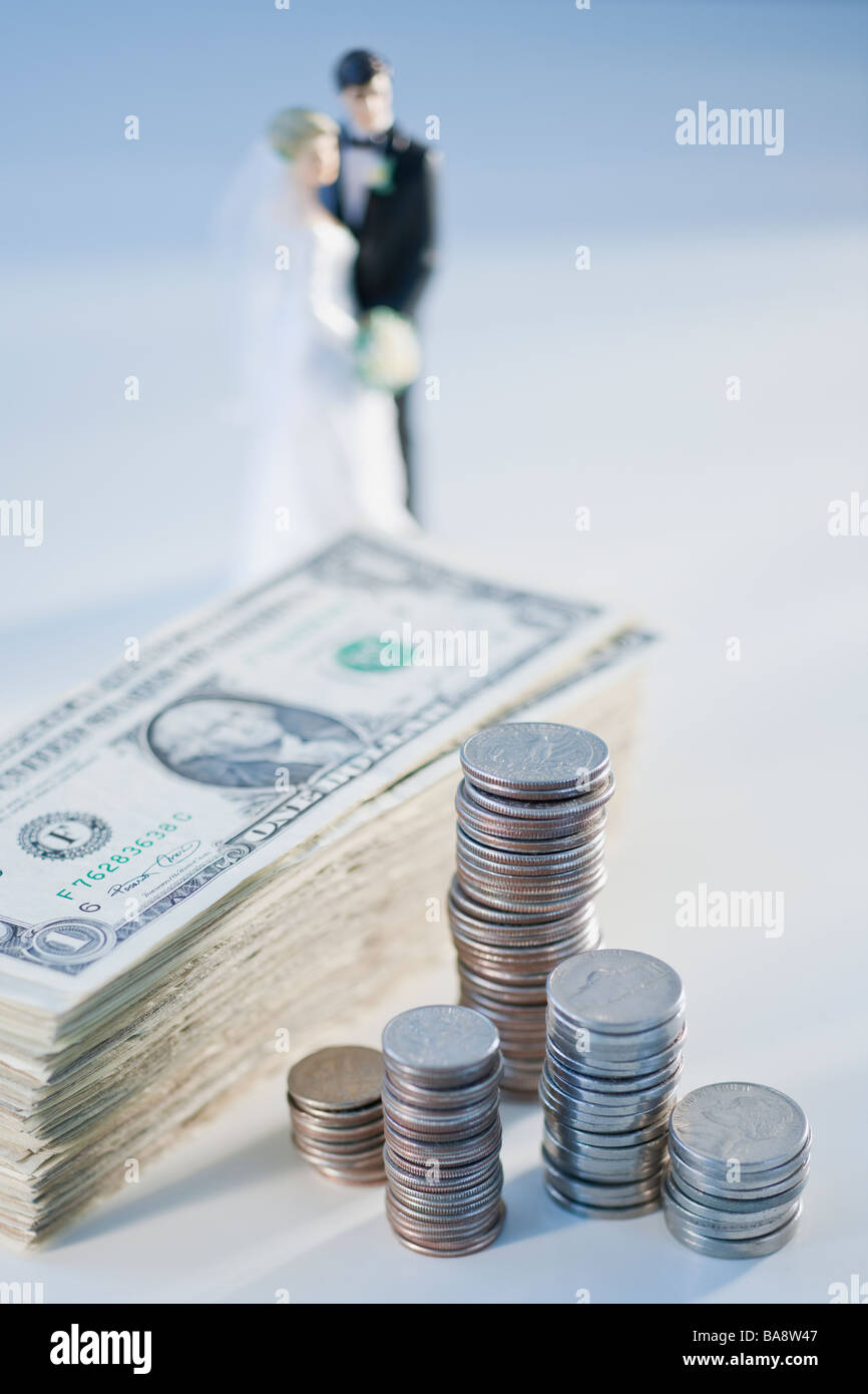Money with bride and groom figurine Stock Photo - Alamy