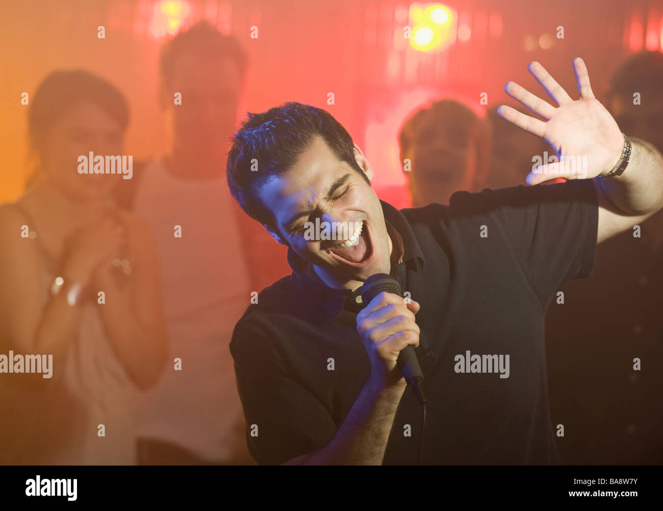 Man singing karaoke Stock Photo - Alamy