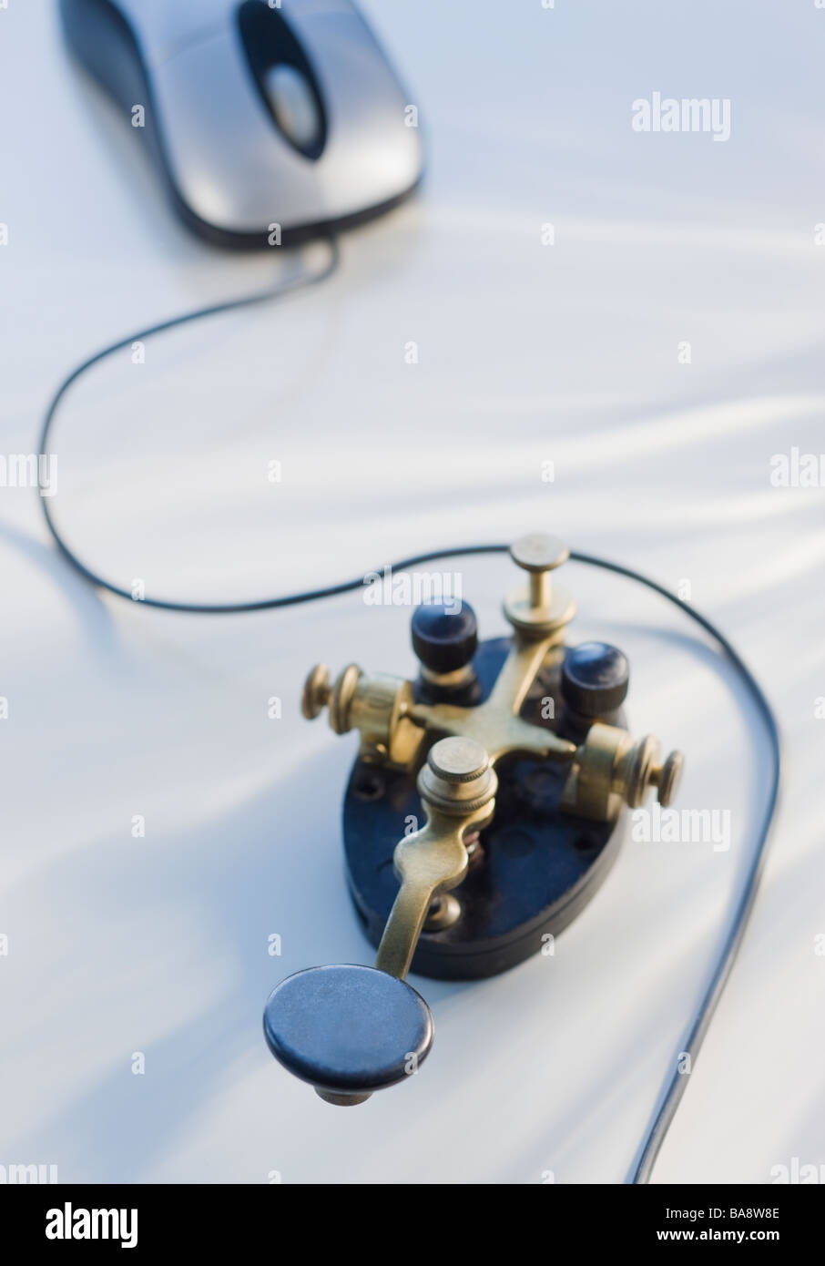 Antique telegraph key and computer mouse Stock Photo - Alamy