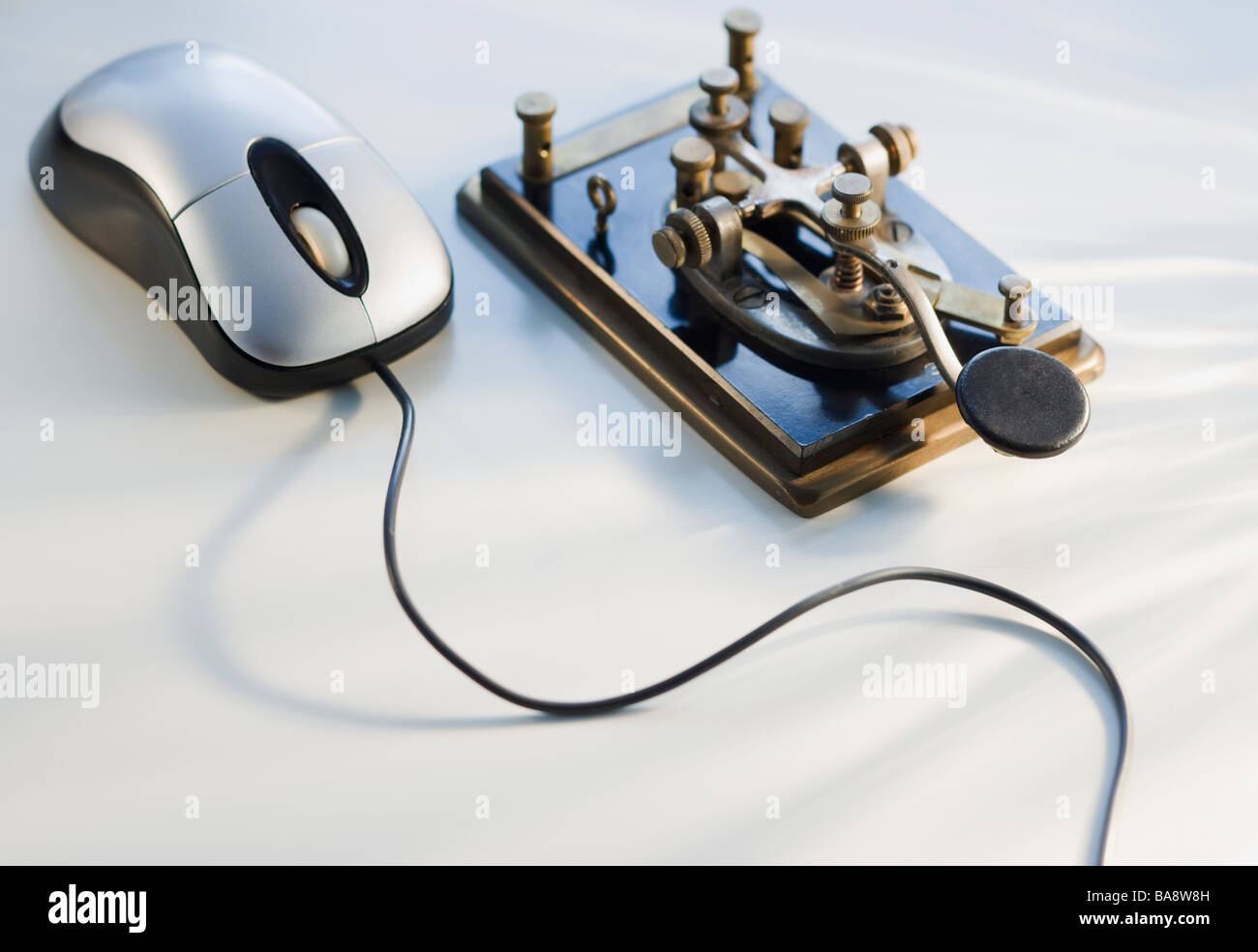 Antique telegraph key and computer mouse Stock Photo - Alamy