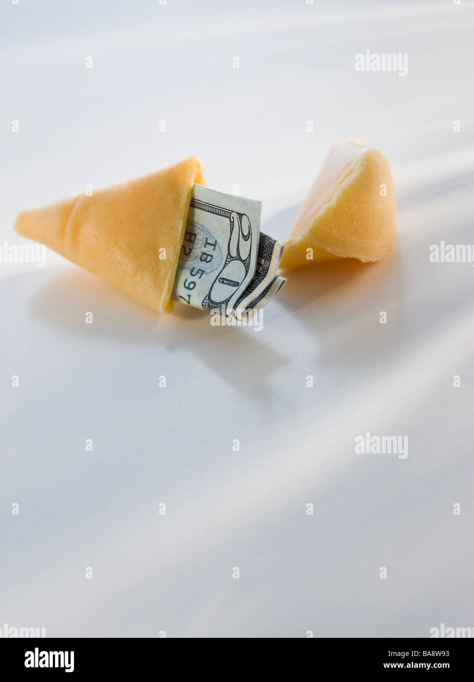Money in fortune cookie Stock Photo - Alamy