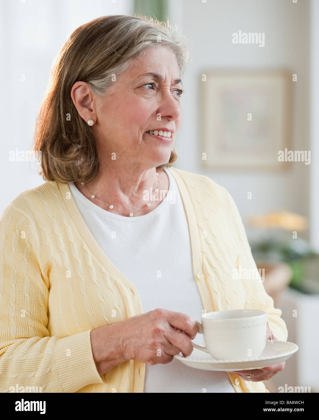 Senior woman drinking tea Stock Photo - Alamy