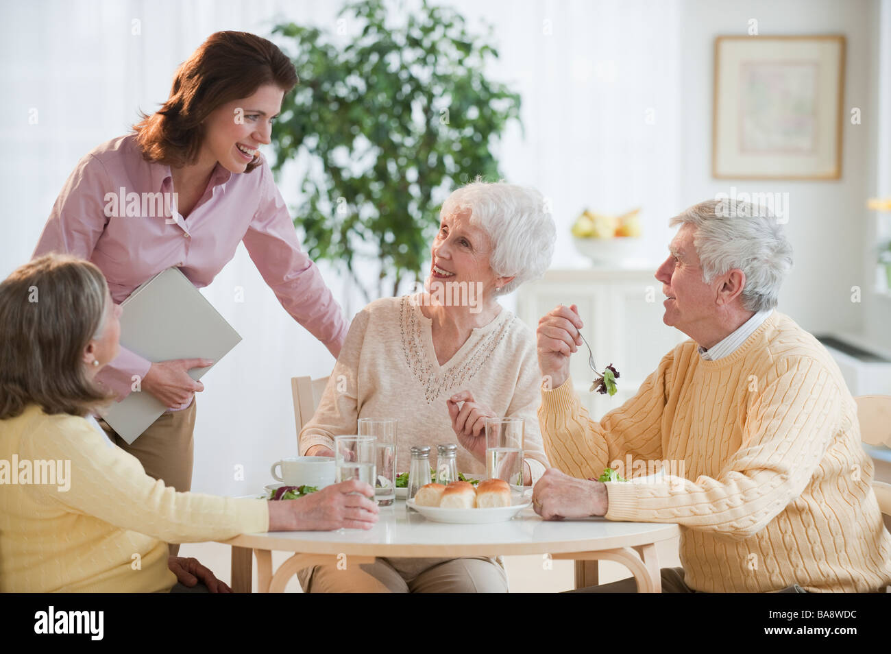 Senior adults eating dinner Stock Photo - Alamy