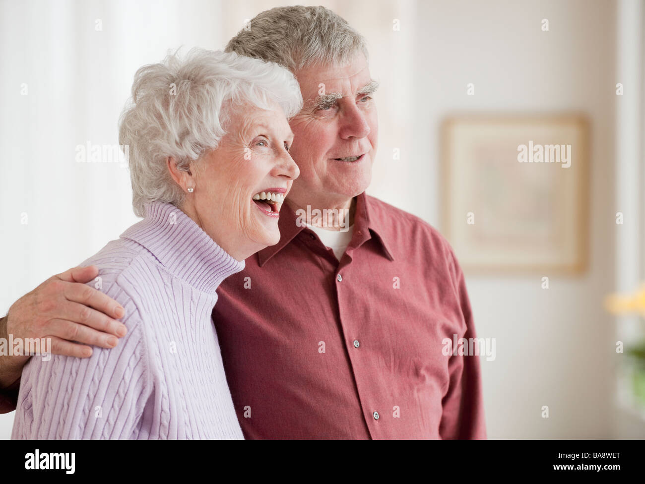 Senior couple hugging Stock Photo - Alamy