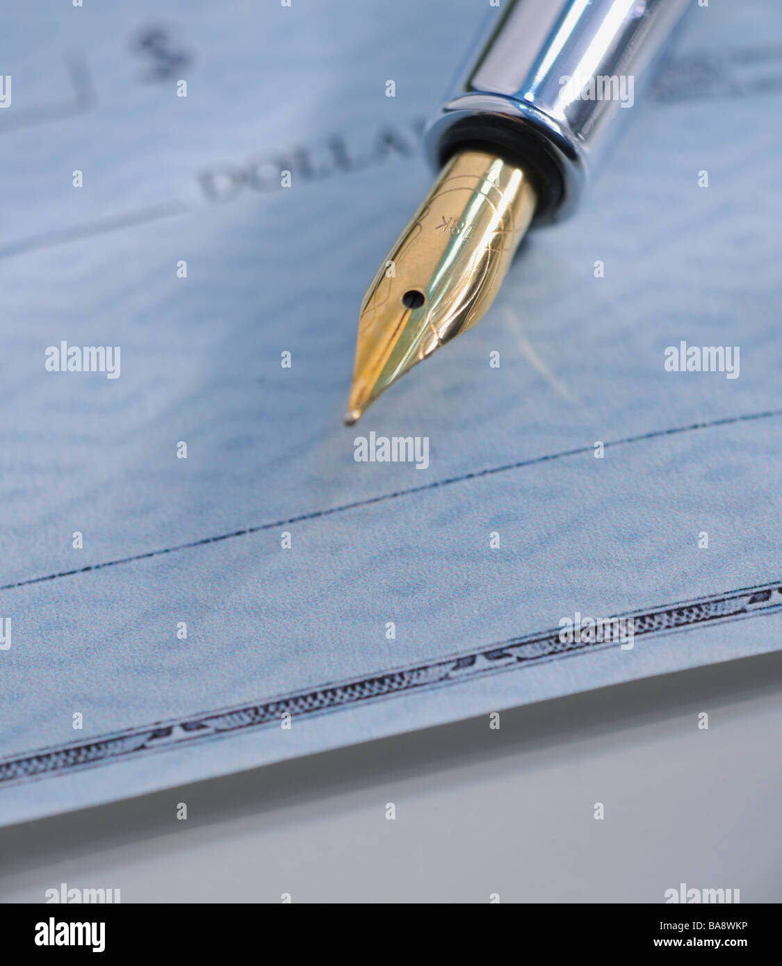 Pen and personal check Stock Photo - Alamy