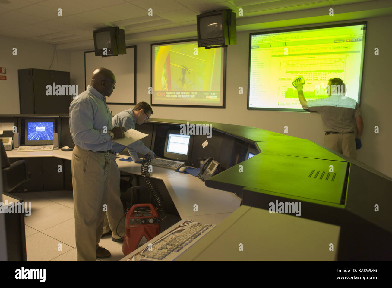 Computer technicians clean servers in high tech environment Stock Photo ...