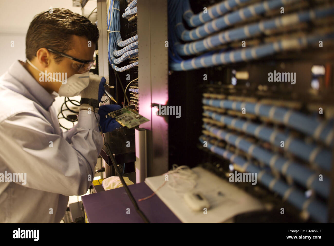 Computer technicians clean servers in high tech environment Stock Photo ...