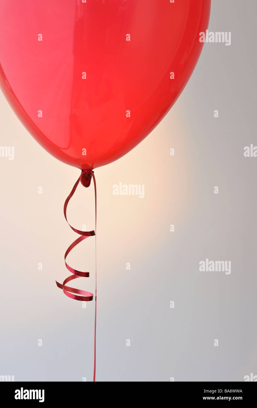 Red balloon and ribbon Stock Photo - Alamy