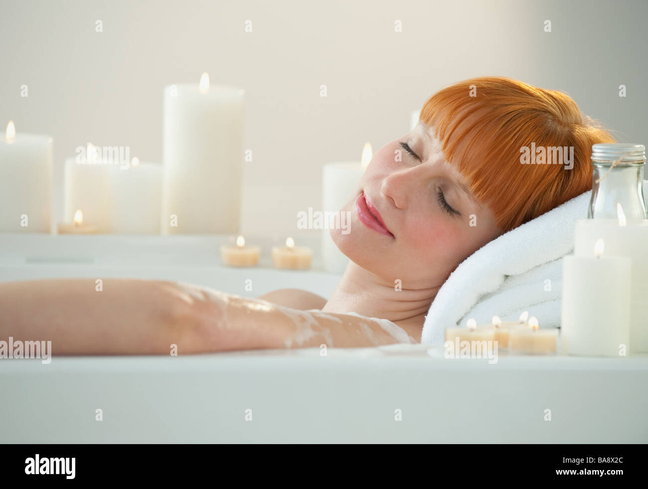Woman relaxing in bathtub Stock Photo - Alamy