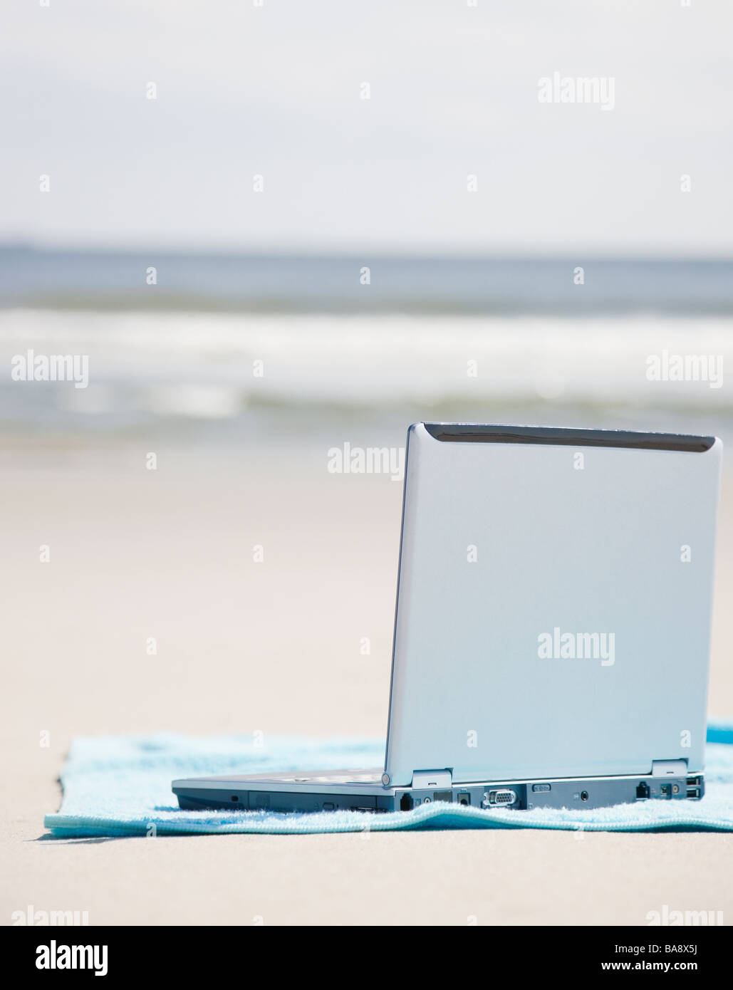 Laptop on beach Stock Photo - Alamy