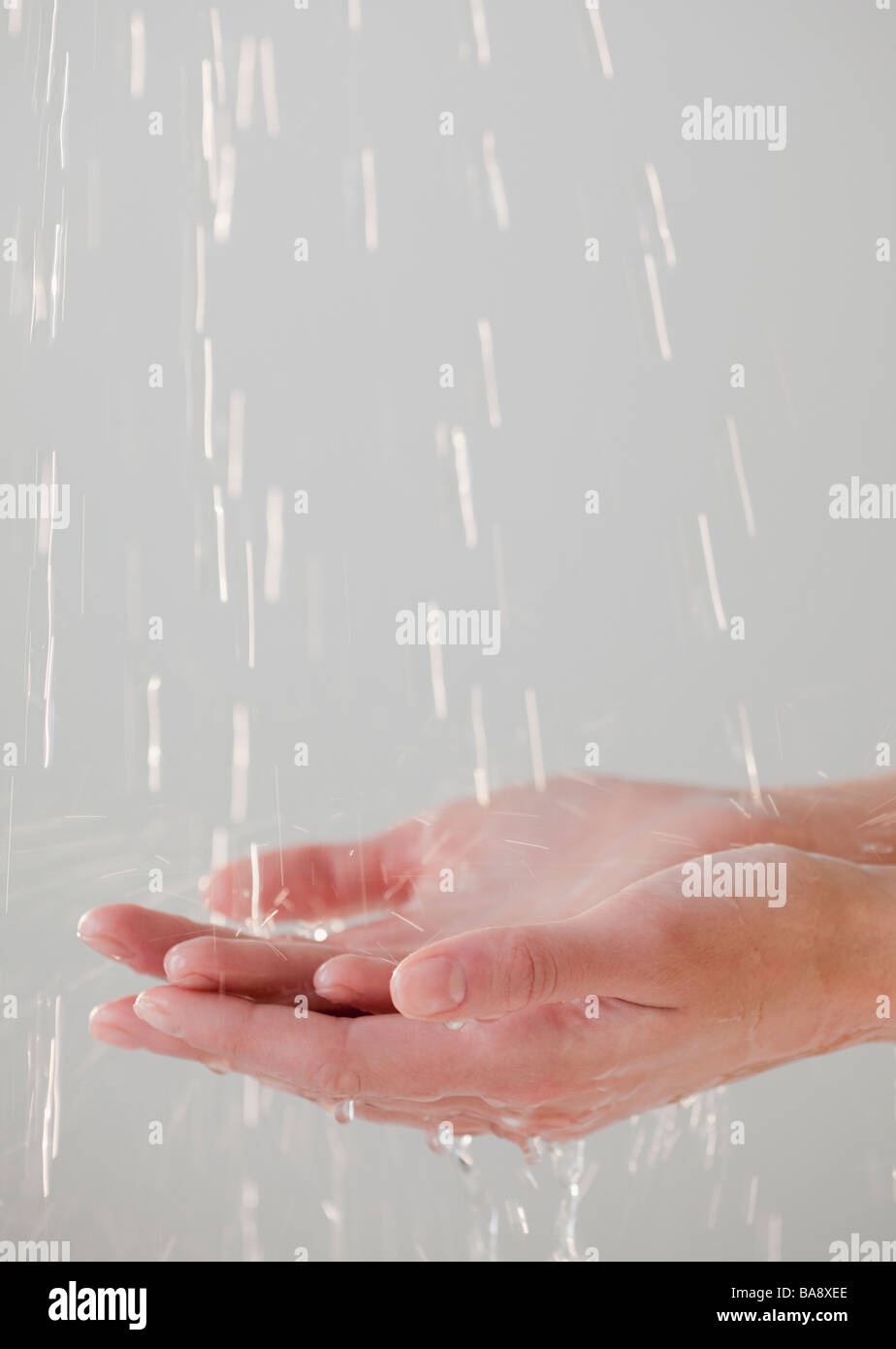 Hands under running water Stock Photo - Alamy