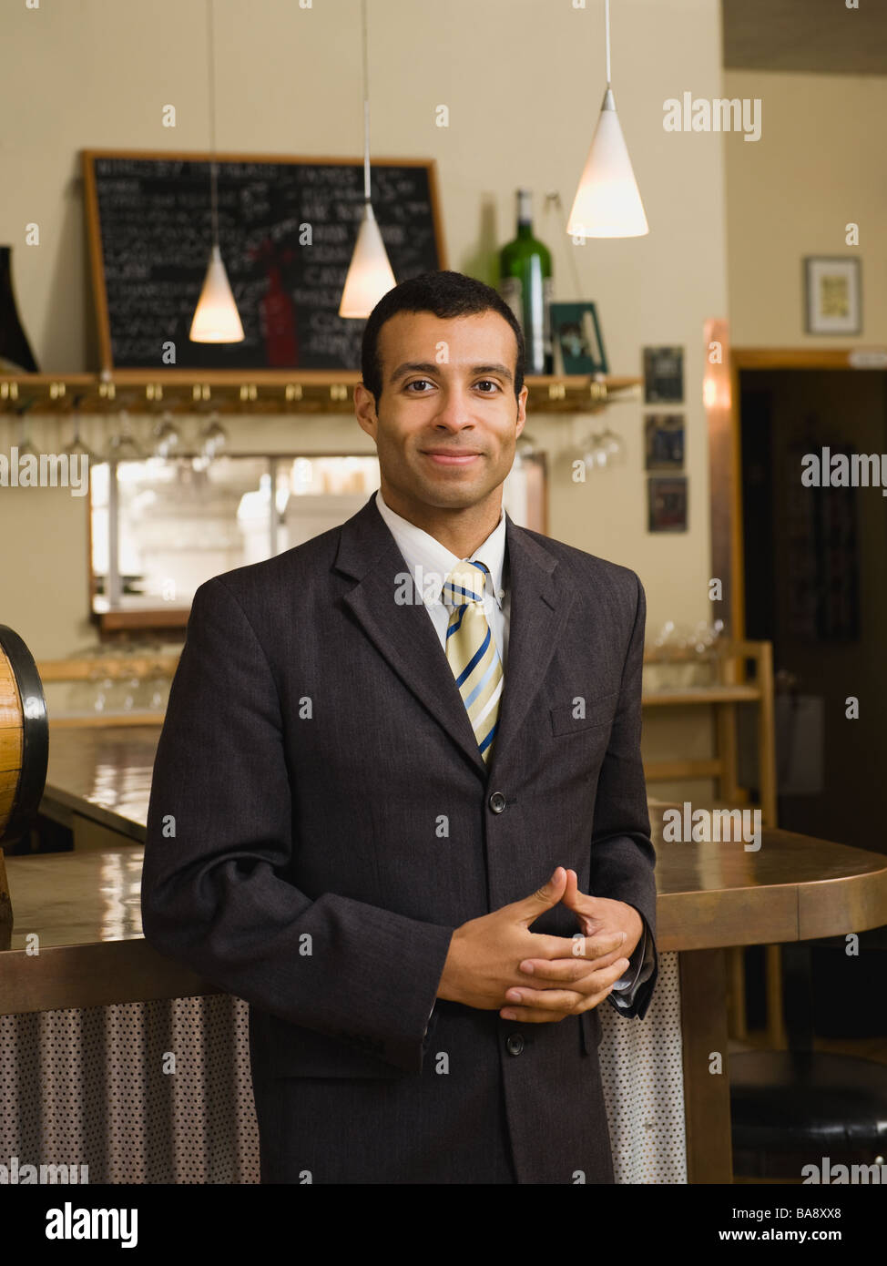 Businessman posing in restaurant Stock Photo - Alamy