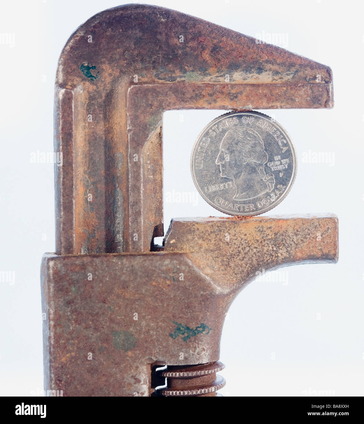 Close up of coin in vice grip Stock Photo - Alamy