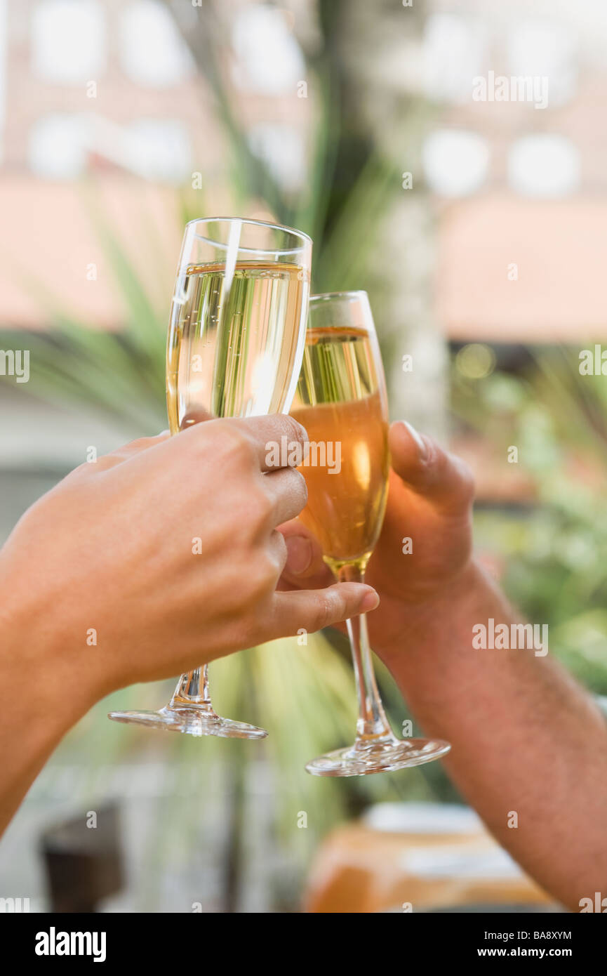 Couple toasting with champagne Stock Photo - Alamy