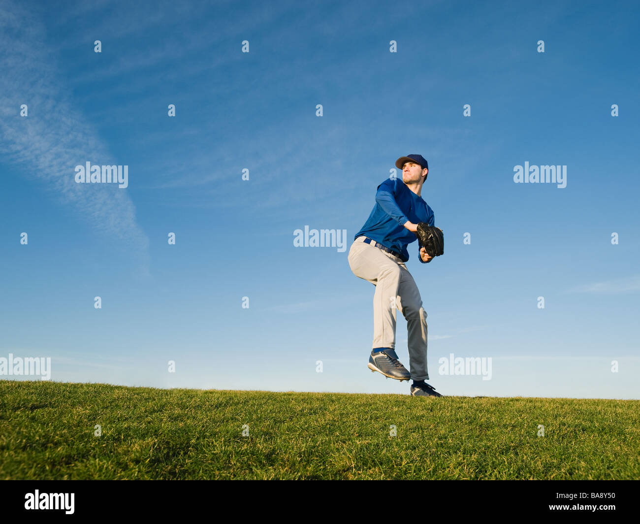 Baseball player throwing ball Stock Photo - Alamy