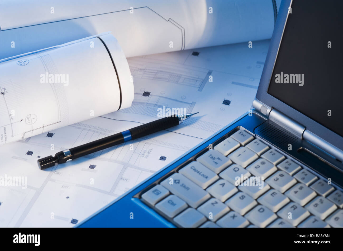 Laptop on blueprints Stock Photo - Alamy