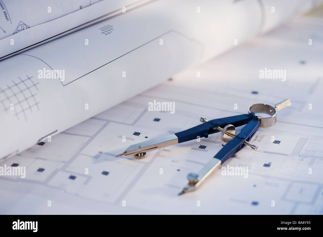Drawing compass and blueprints Stock Photo - Alamy