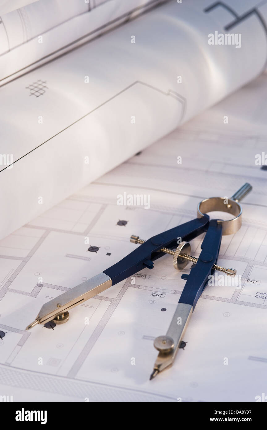Drawing compass and blueprints Stock Photo - Alamy