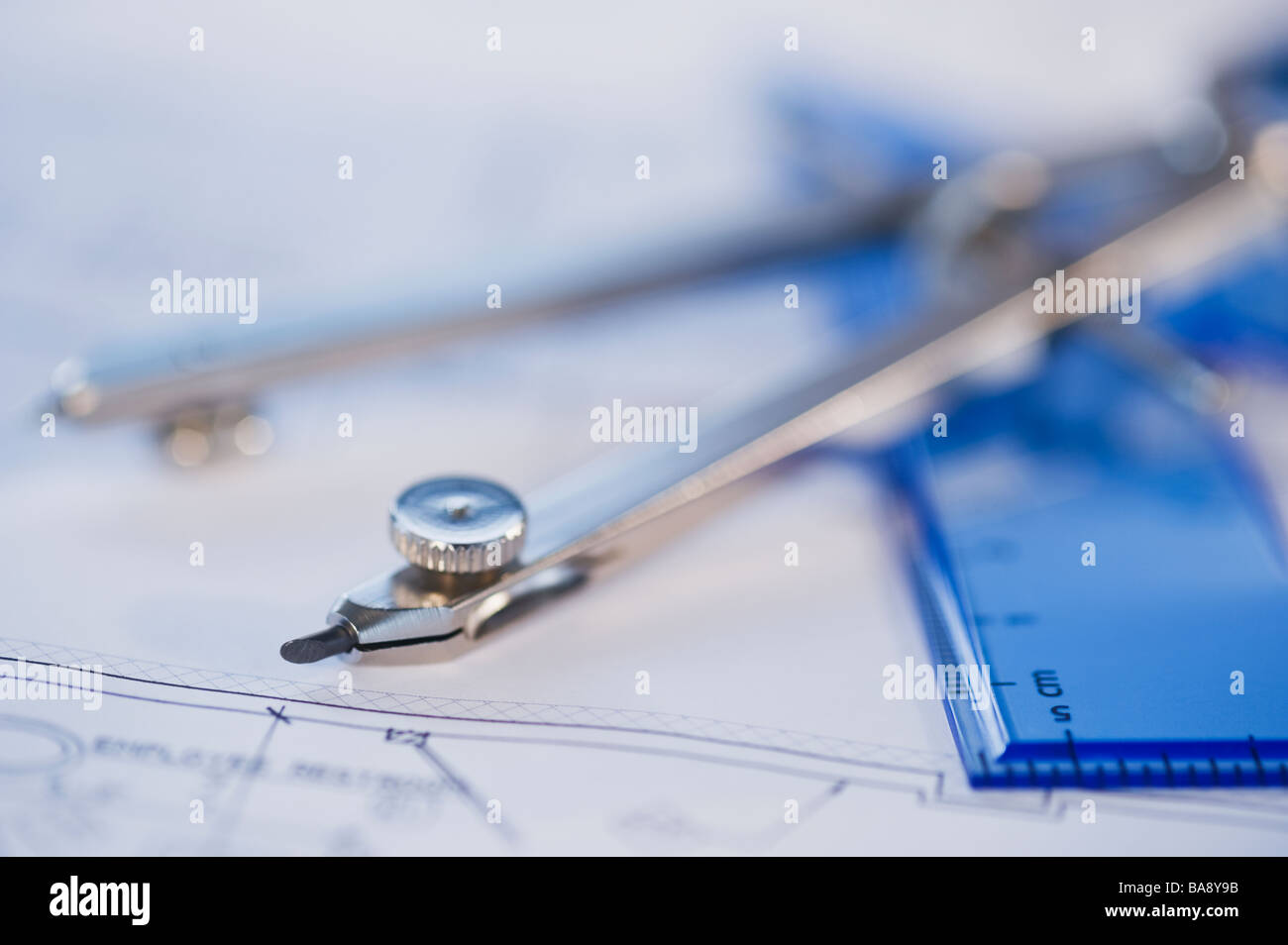 Drawing compass and blueprints Stock Photo - Alamy