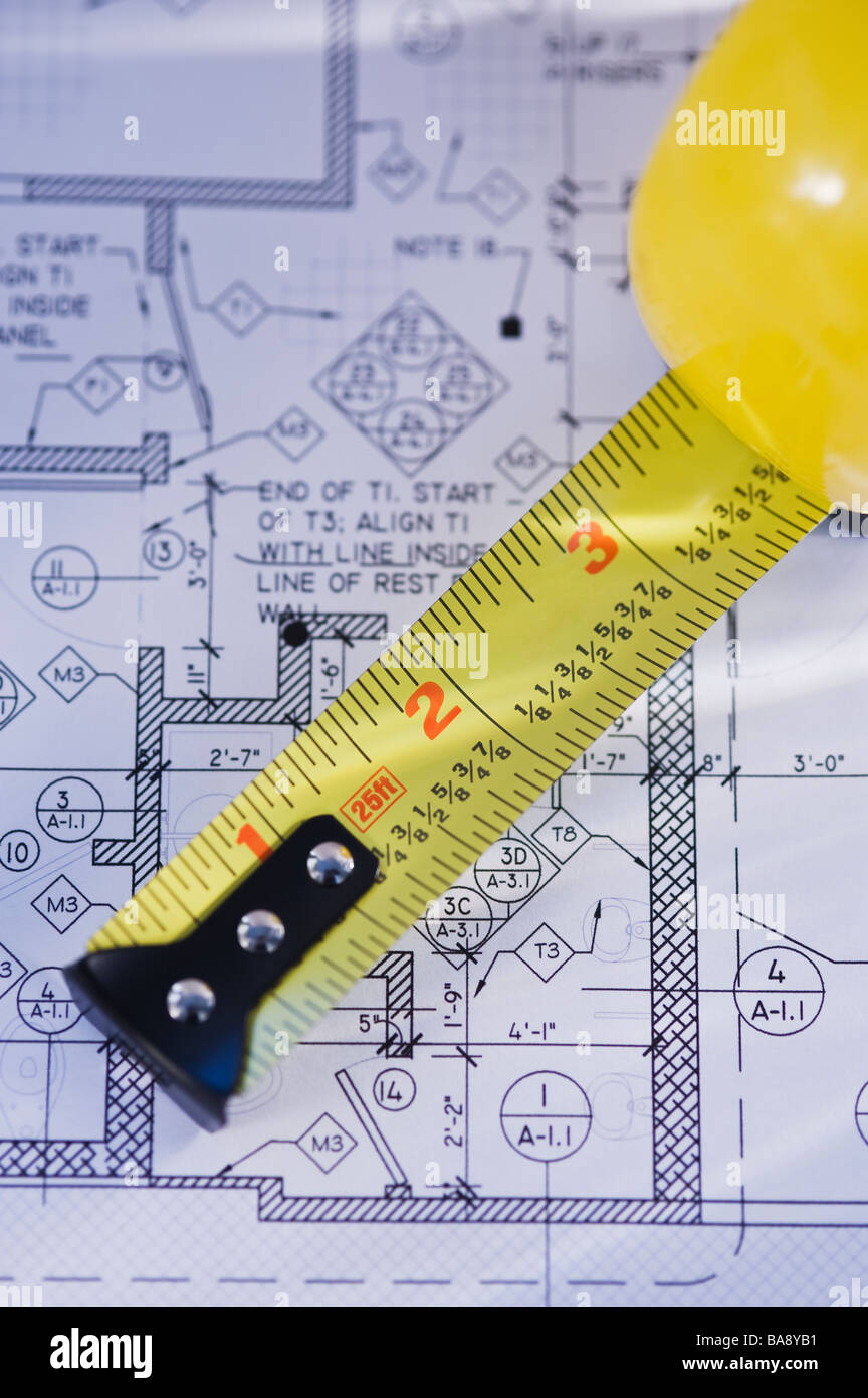 Close up of blueprint and tape measure Stock Photo - Alamy