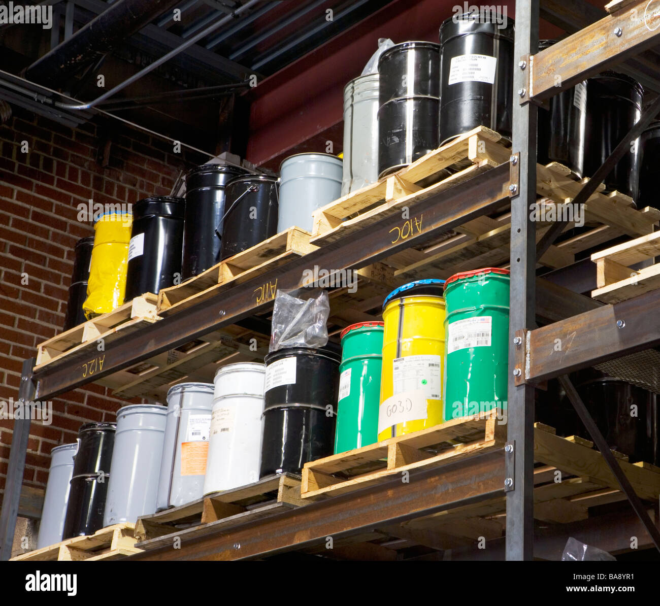 Paint cans on warehouse shelf Stock Photo - Alamy