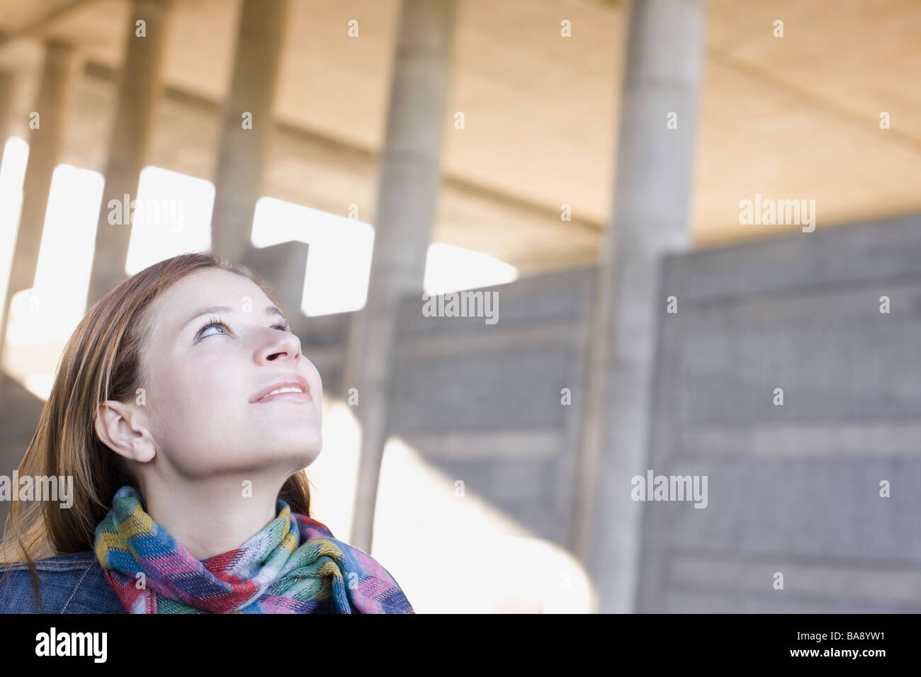 Young woman looking up Stock Photo - Alamy