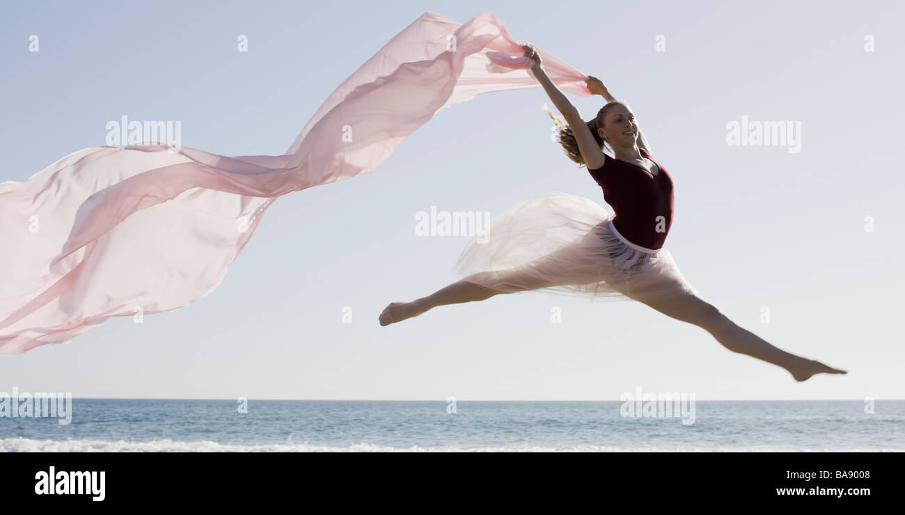 Dancer Leaping On Beach
