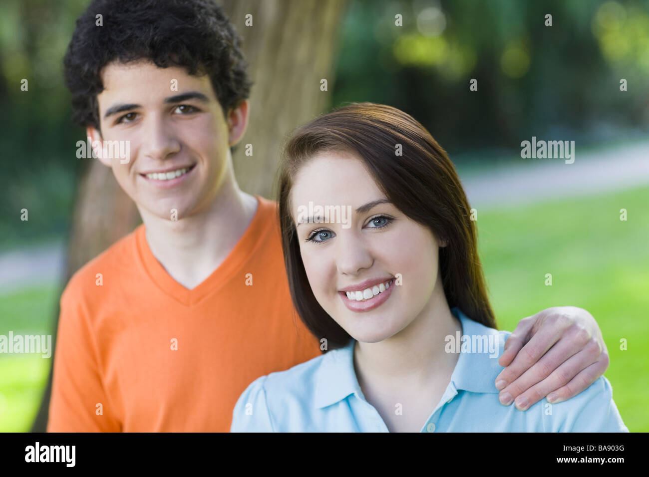 Friends posing in park Stock Photo - Alamy