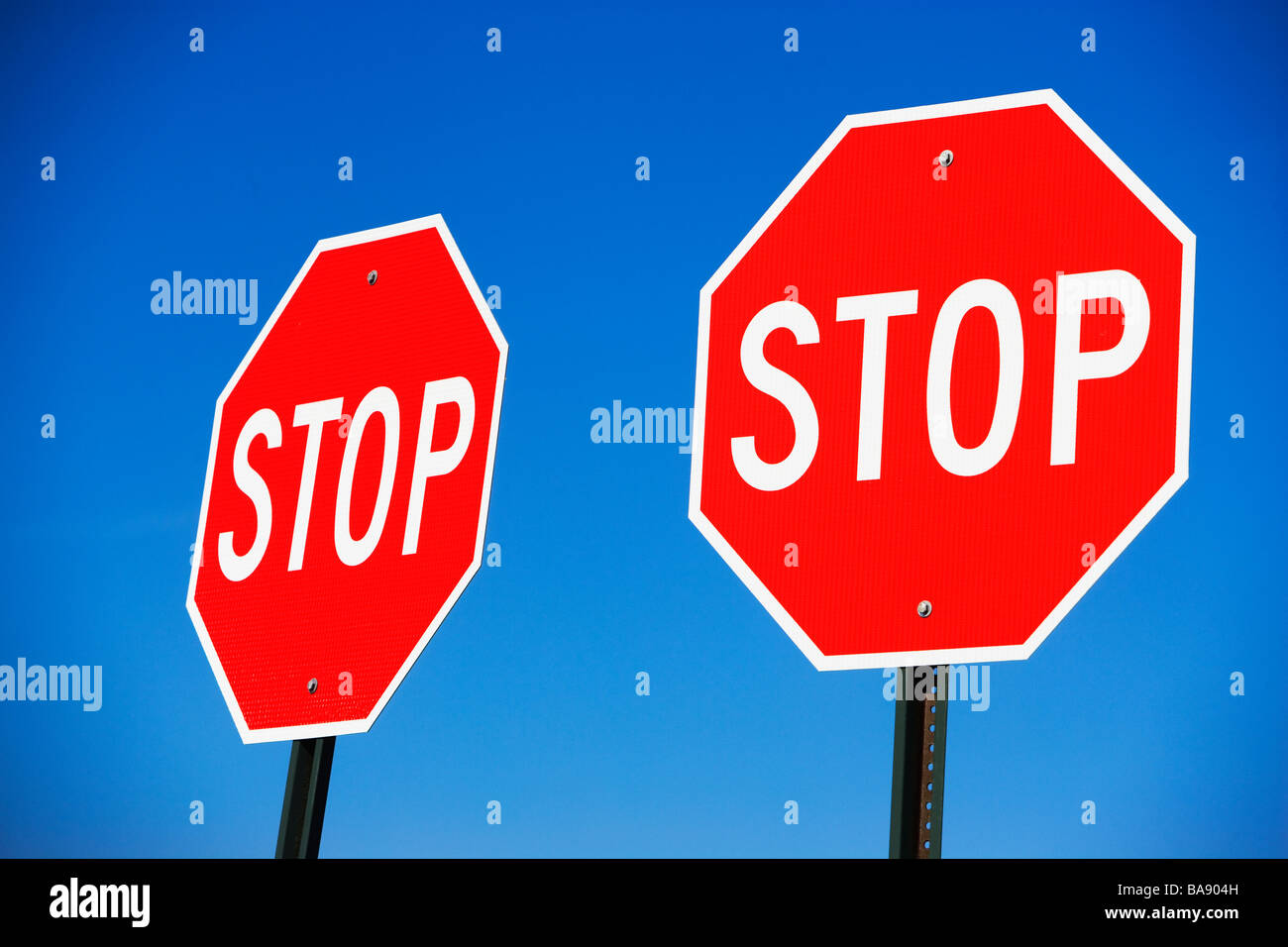 Two stop signs Stock Photo - Alamy
