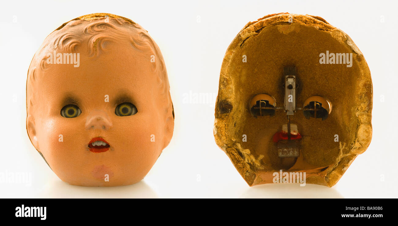 Broken antique baby doll head Stock Photo - Alamy