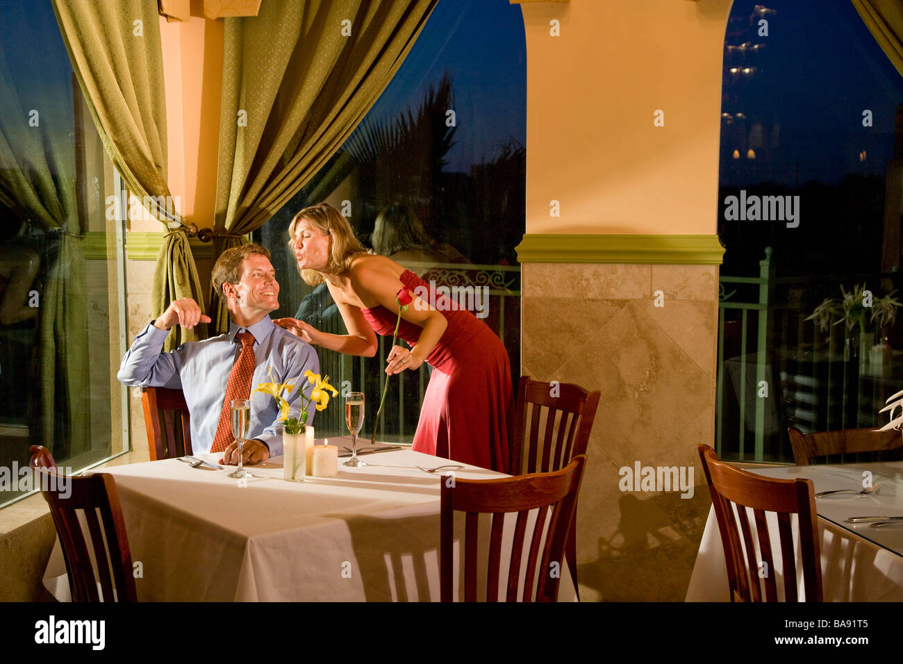 Man bending over kiss woman hi-res stock photography and images - Alamy