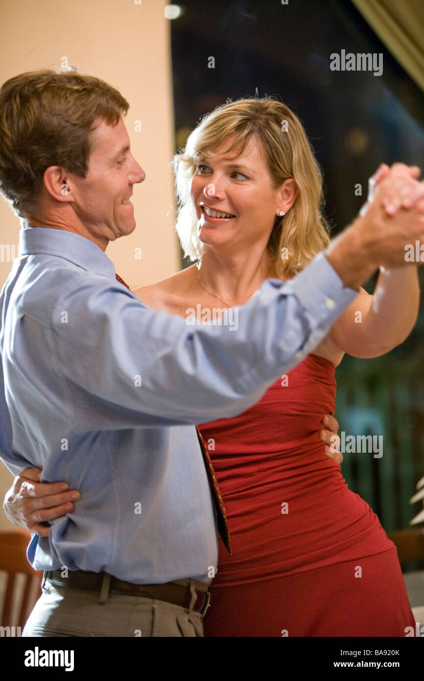 Couple in love dancing at fine dining restaurant Stock Photo - Alamy