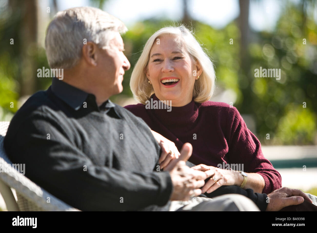 Portrait of senior couple relaxing on veranda of house Stock Photo - Alamy