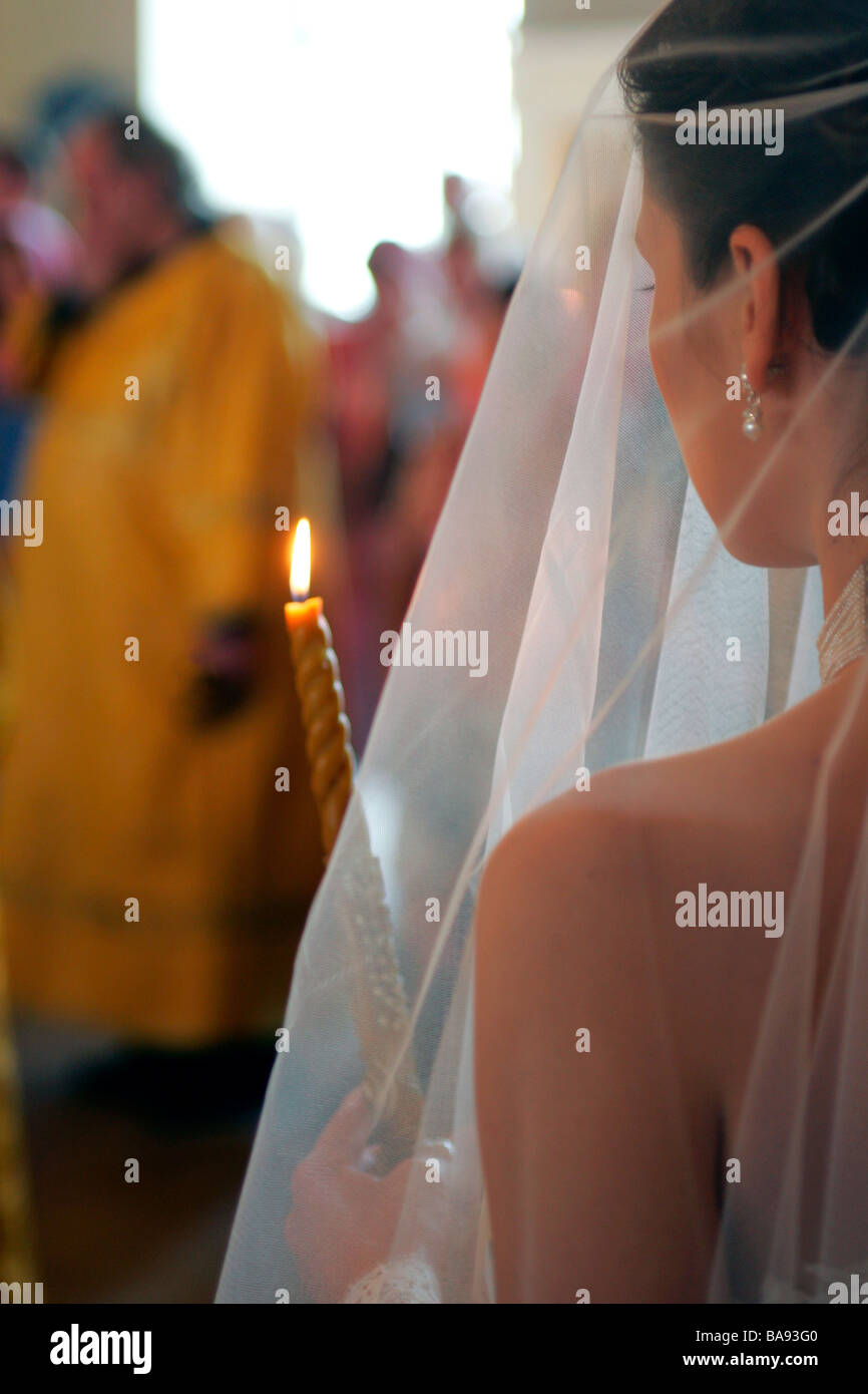 Woman lighting candle back view hi-res stock photography and images - Alamy