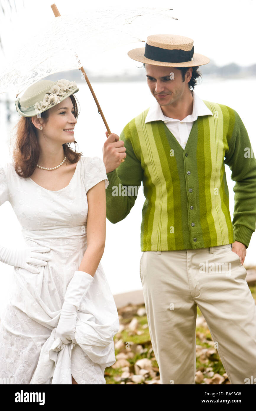 Portrait of 1920s socialites by water Stock Photo - Alamy