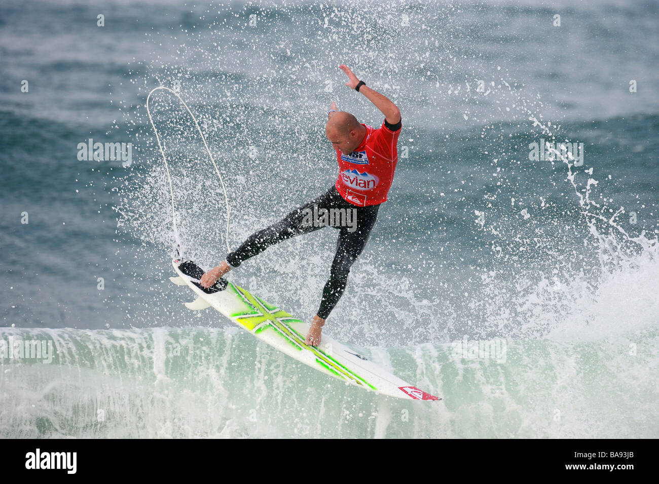 Surfer perfoming a Jump of a Wave Stock Photo - Alamy
