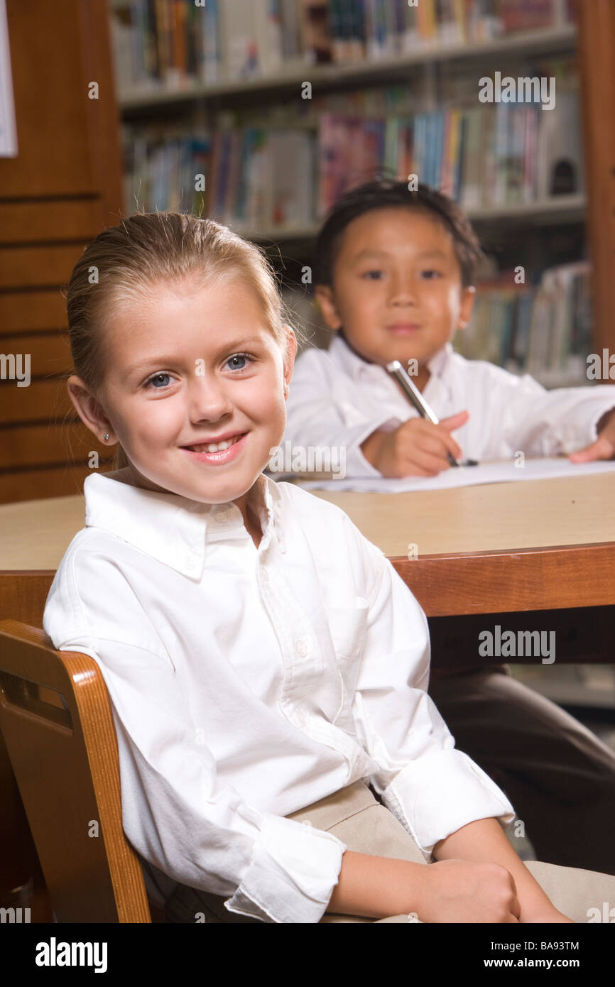Portrait of school kids in library Stock Photo - Alamy