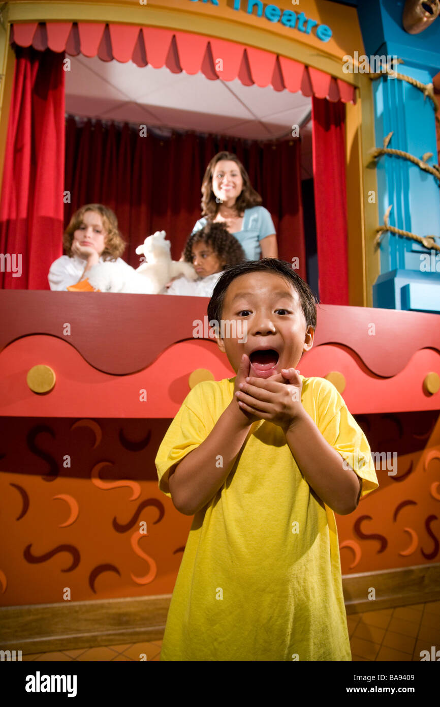 Asian school boy with classmates and teacher in puppet theatre Stock ...