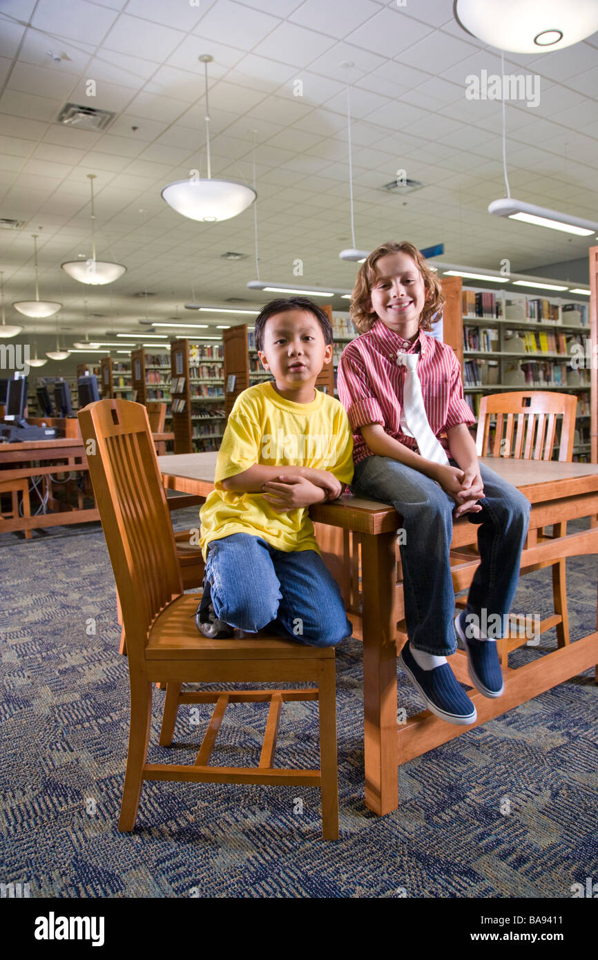Children sitting school library table hi-res stock photography and ...