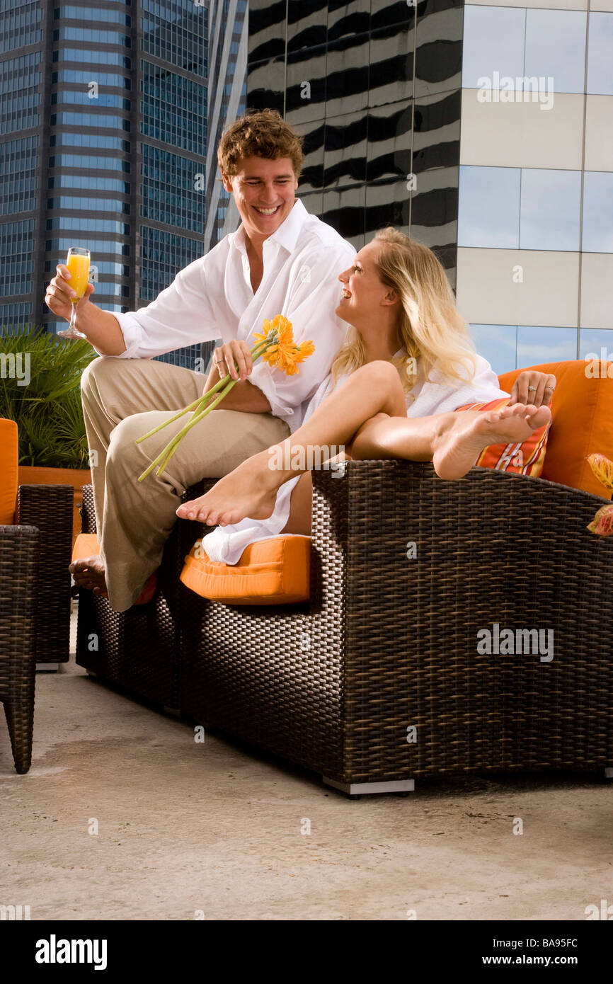 Young romantic couple on rooftop terrace in city Stock Photo - Alamy