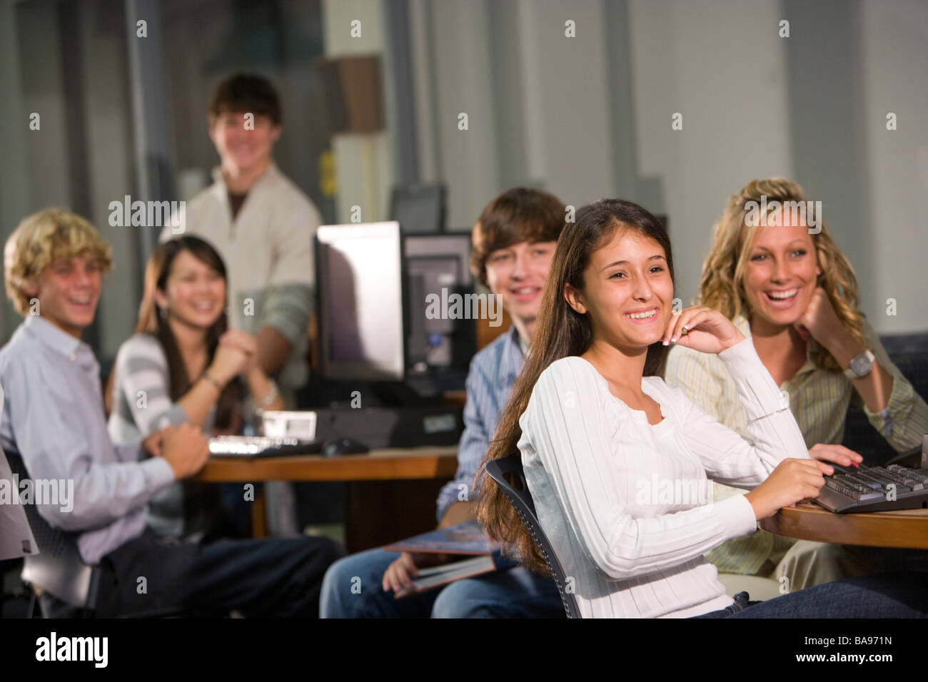 Group of high school students smiling in computer lab Stock Photo - Alamy