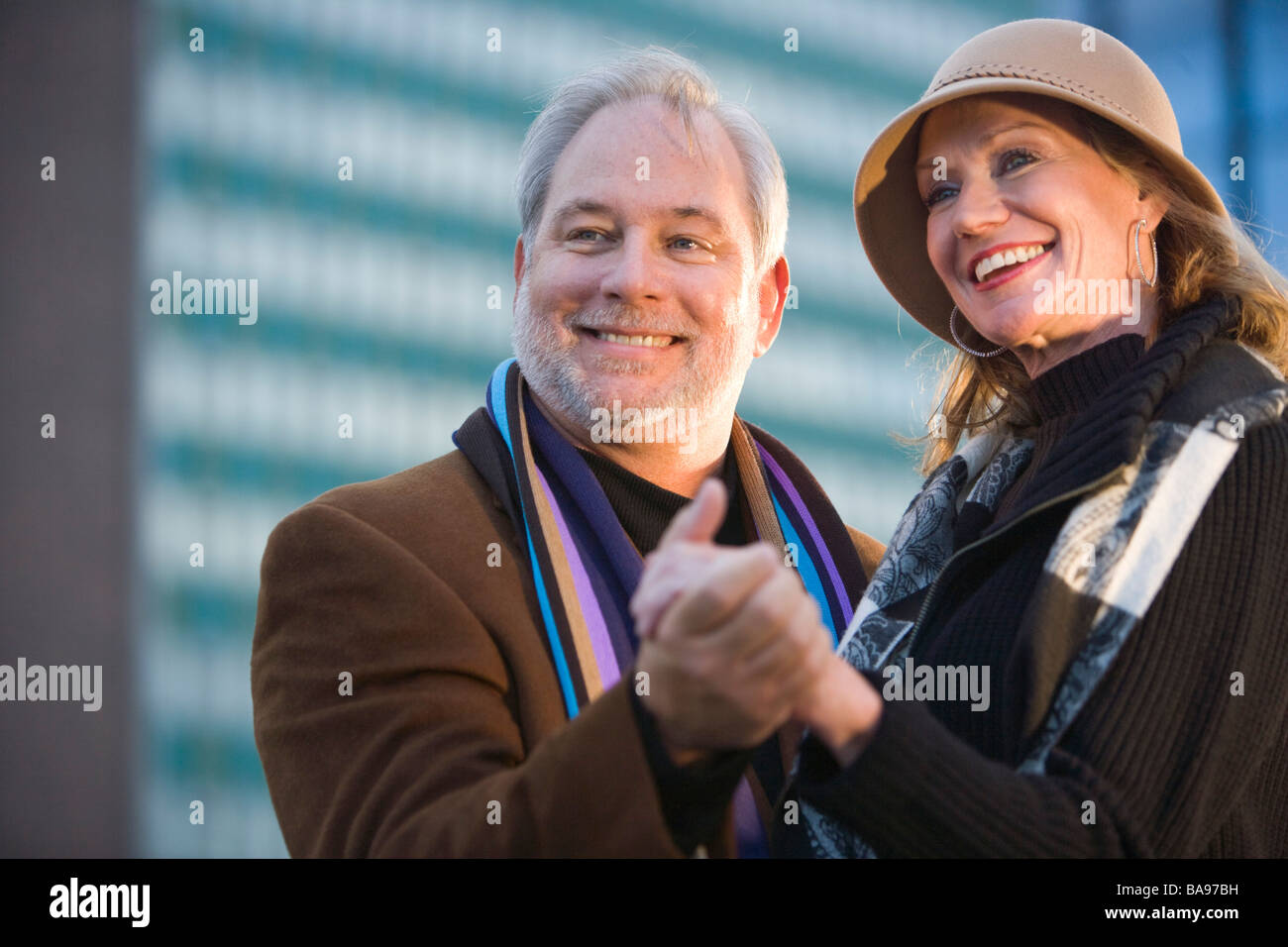 Middle-aged couple dancing on rooftop of modern downtown loft Stock ...