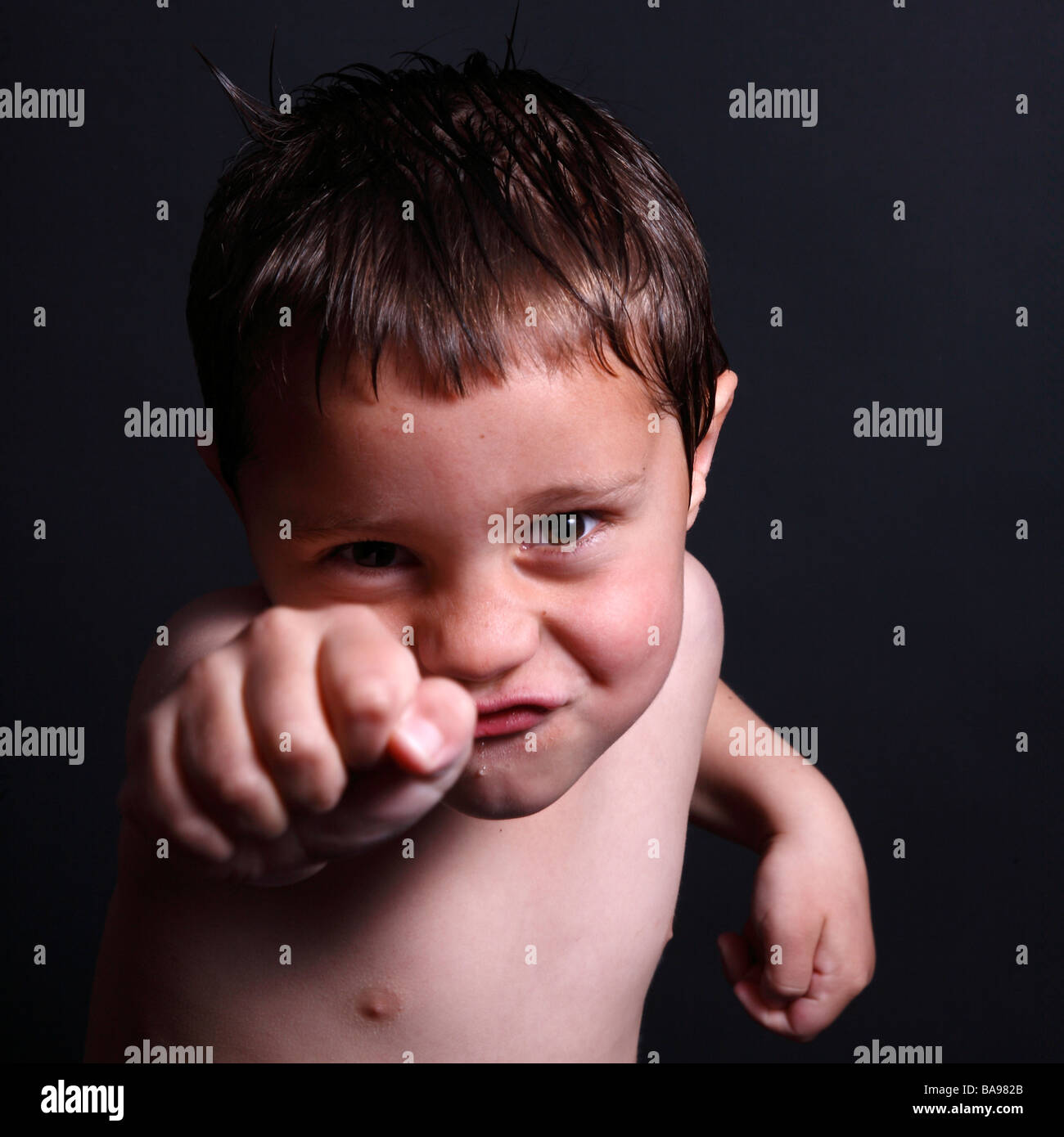Young boy pretend boxing Stock Photo - Alamy