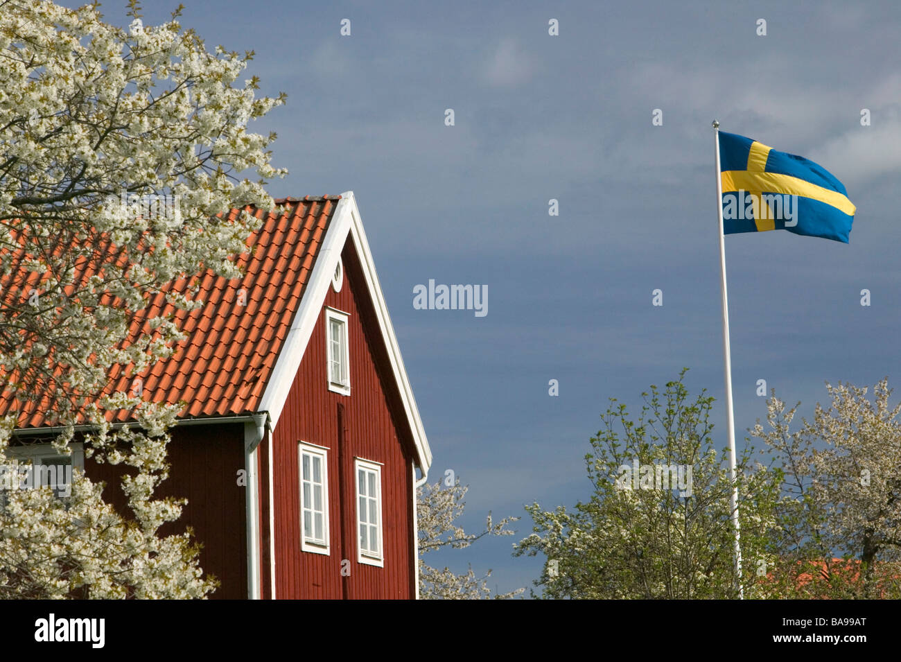 The Swedish flag ouside a red house Sweden Stock Photo - Alamy