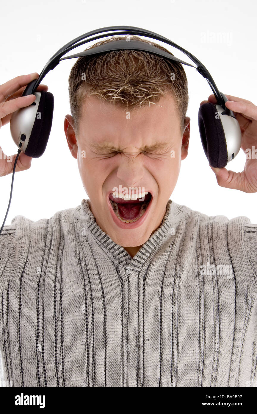 shouting young man holding the headphone Stock Photo - Alamy