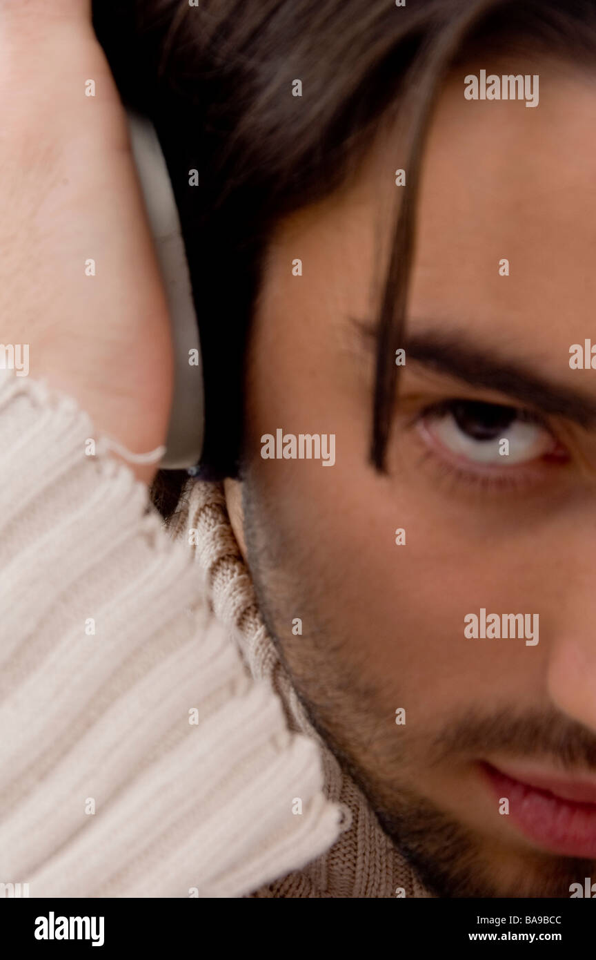 half face pose of young handsome male wearing headphones Stock Photo ...