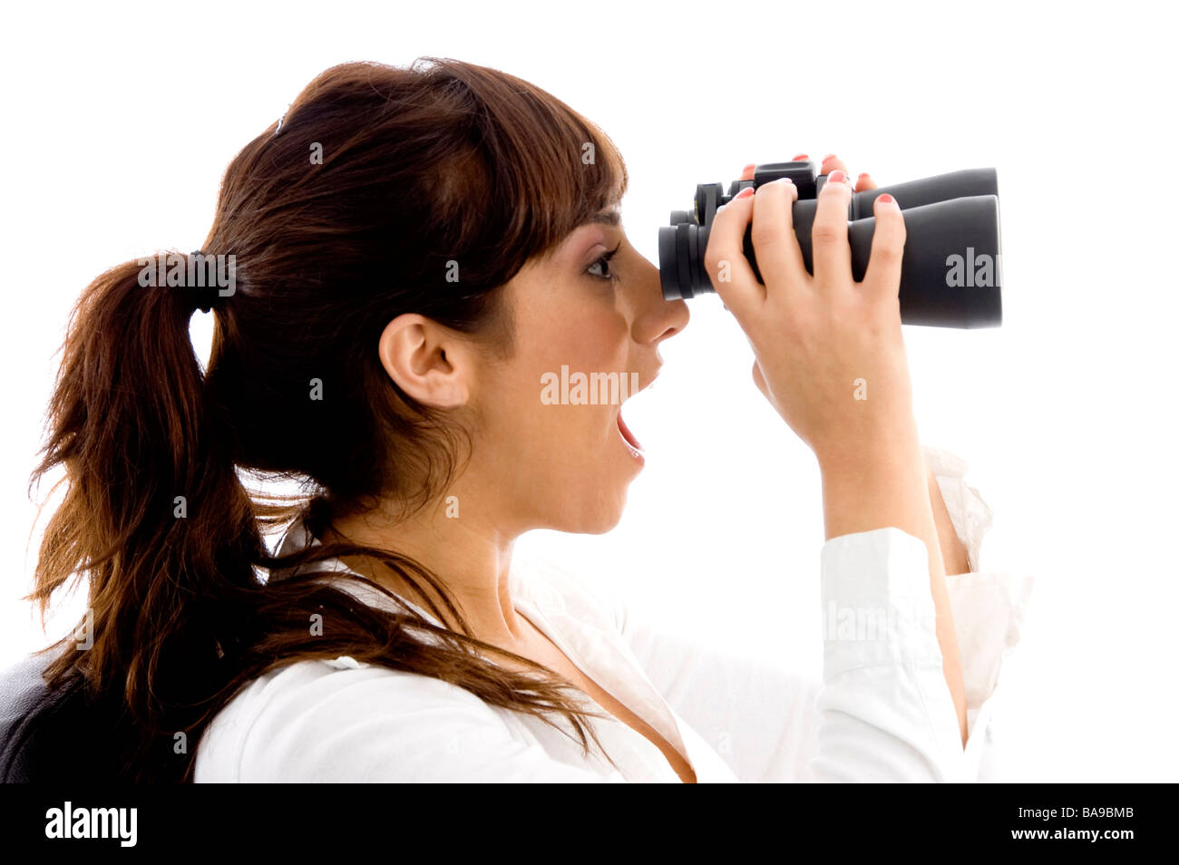 side view of shocked female viewing through binoculars executive Stock ...